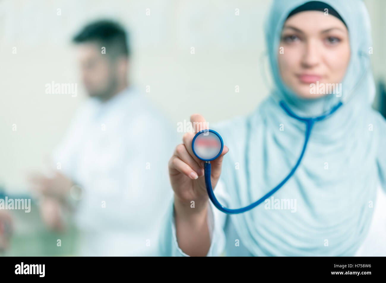 Front view of an arab doctor woman showing stethoscope Stock Photo - Alamy