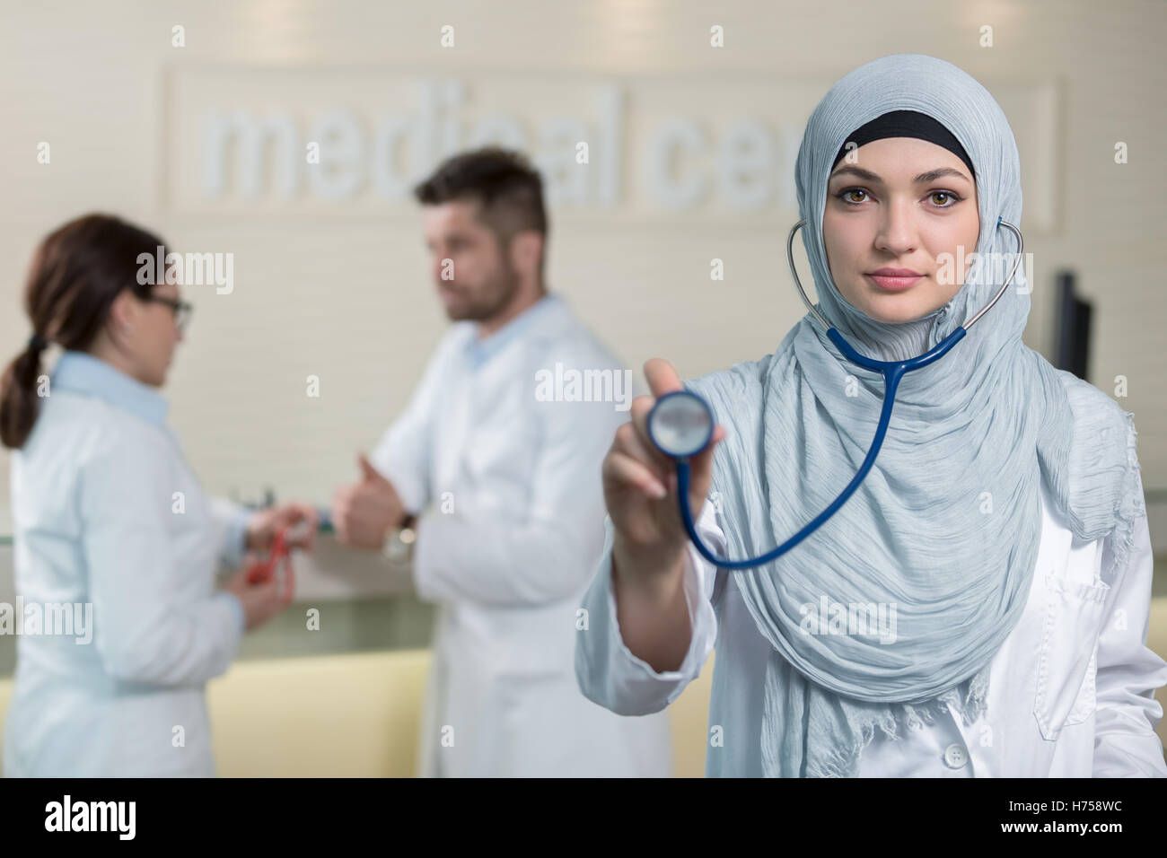 Front view of an arab doctor woman showing stethoscope Stock Photo - Alamy