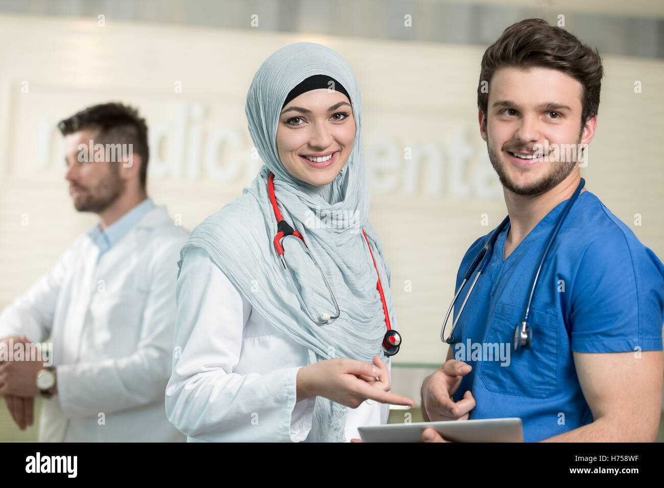 Saudi arab doctors working with a tablet Stock Photo - Alamy