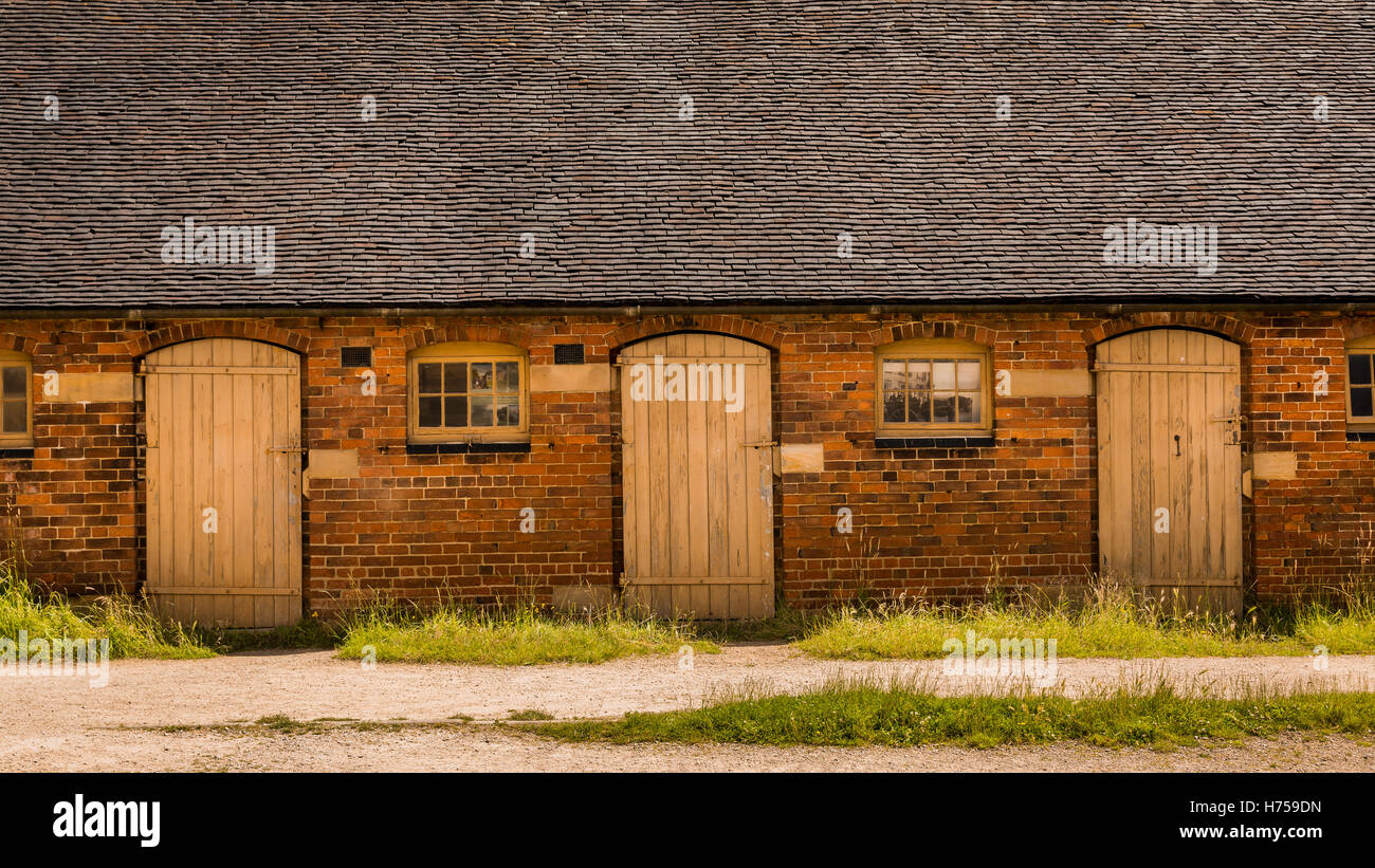 three door brick barn Stock Photo - Alamy