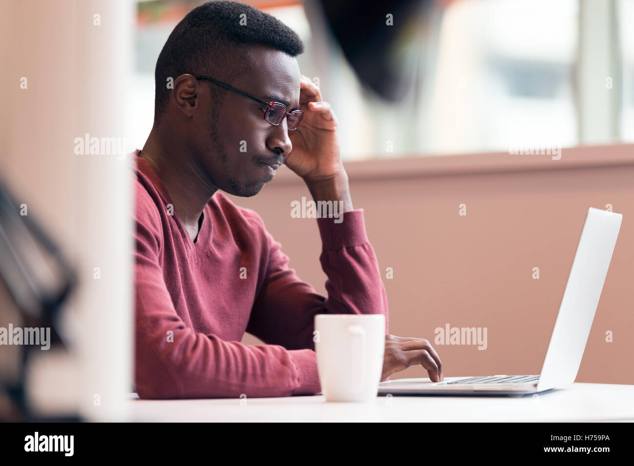 Handsome African American looking at the screen with serious face ...