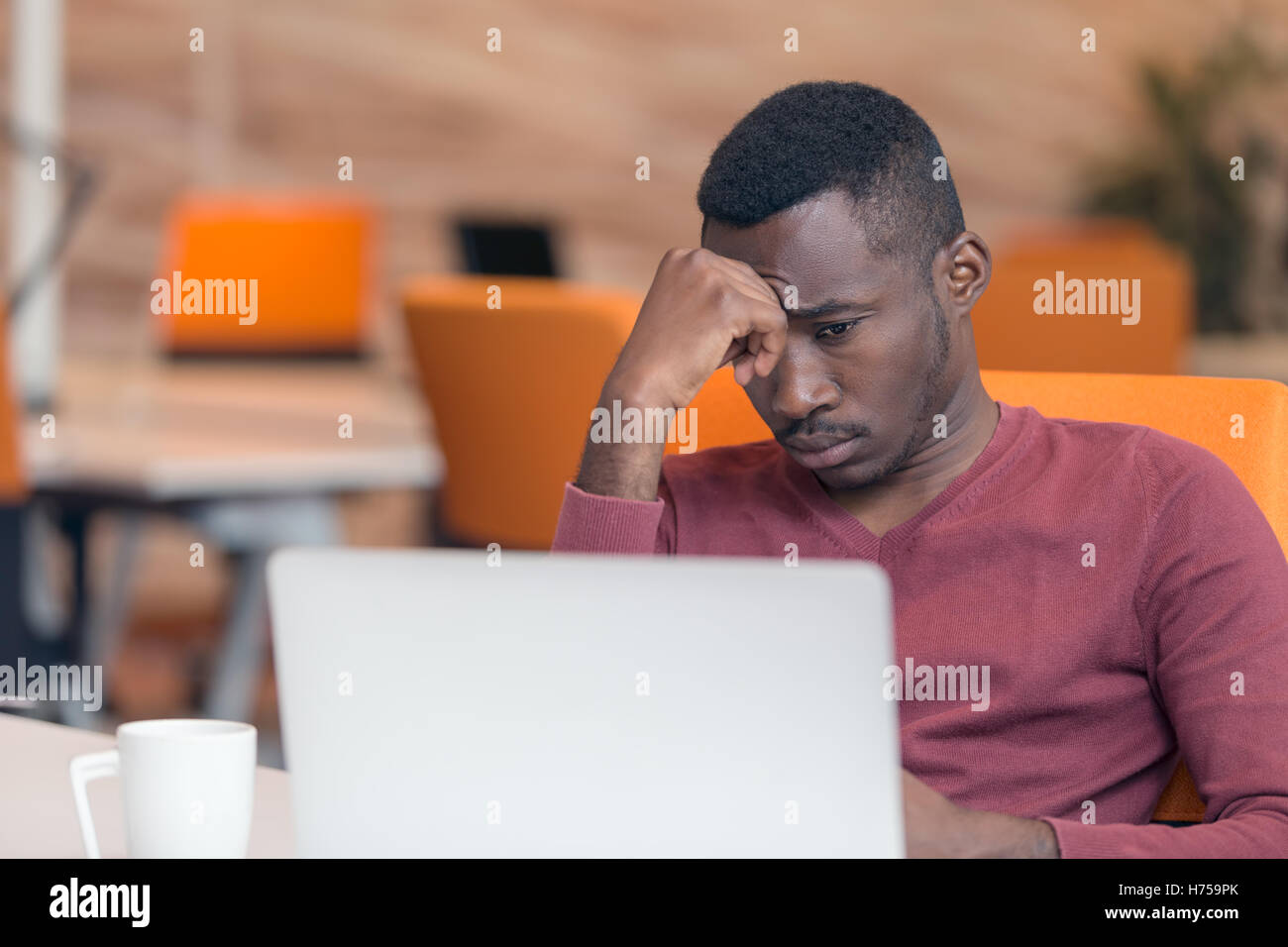 Handsome African American looking at the screen with serious face ...