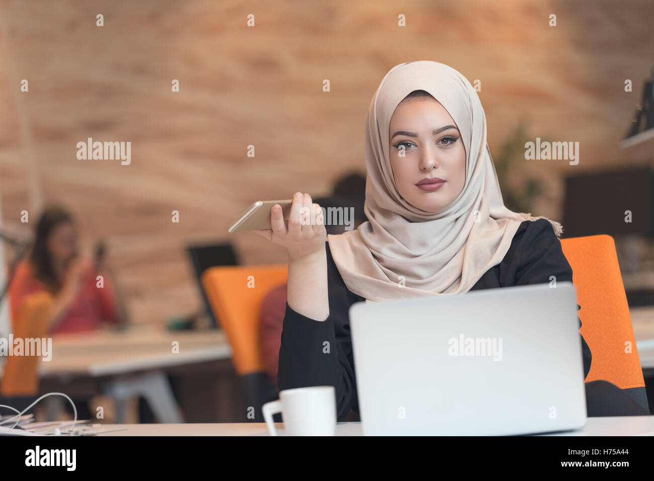 Young Arabic business woman wearing hijab,working in her startup office ...