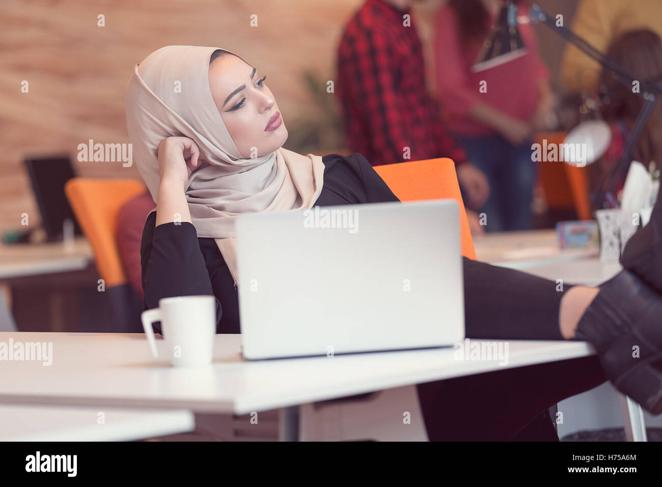 Arabic business woman wearing hijab, working in startup office Stock ...