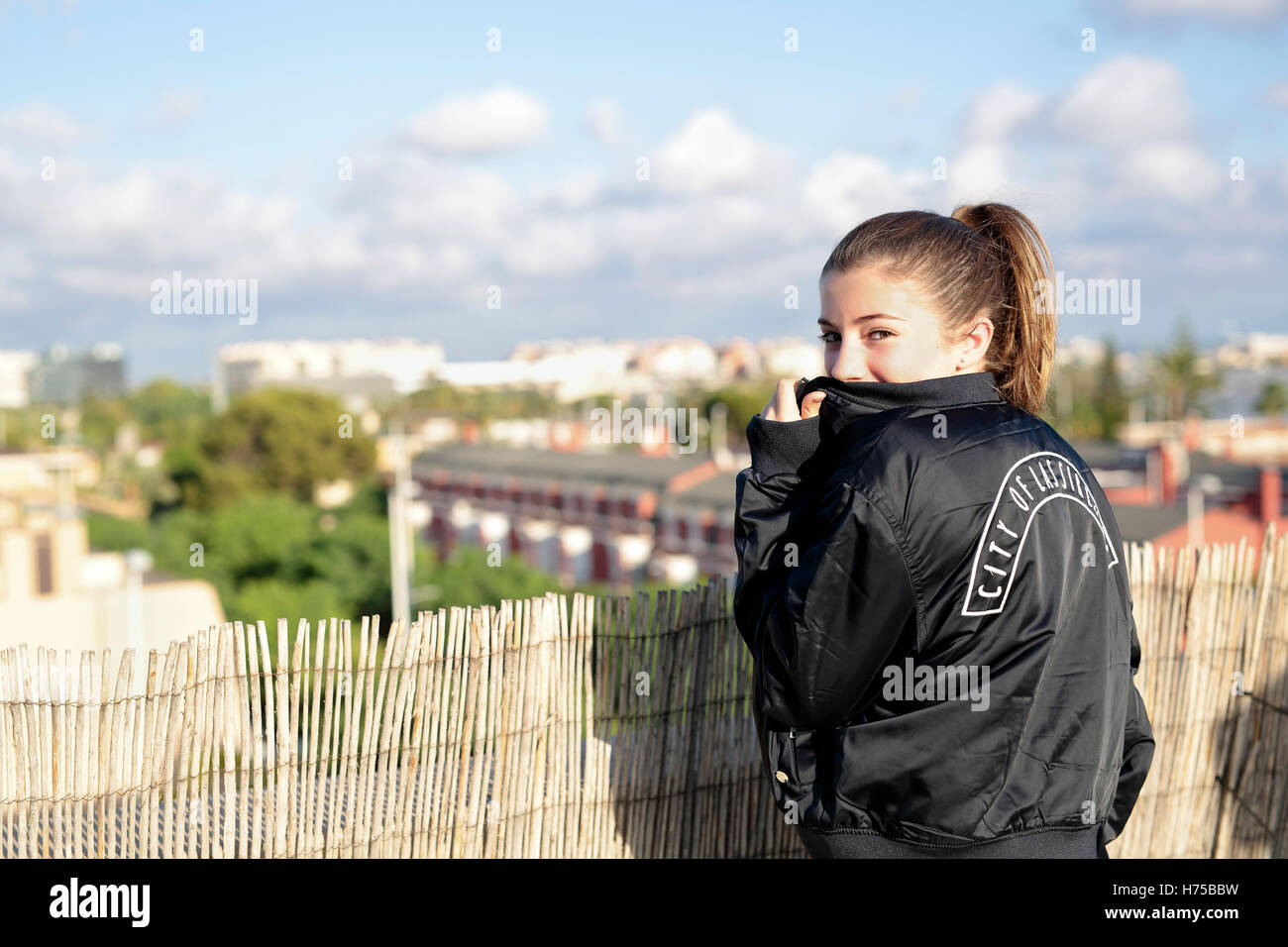Teenager on the roof of a building. Natural daylight, horizontal shoot ...