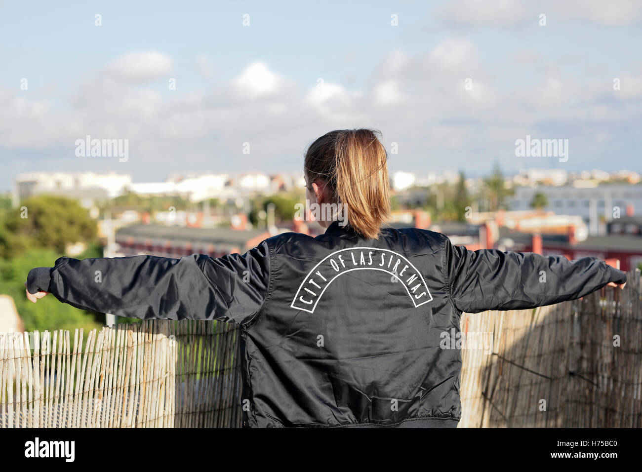 Teenager on the roof of a building. Natural daylight, horizontal shoot ...