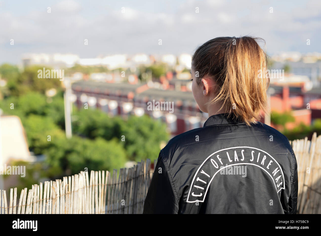 Teenager on the roof of a building. Natural daylight, horizontal shoot ...
