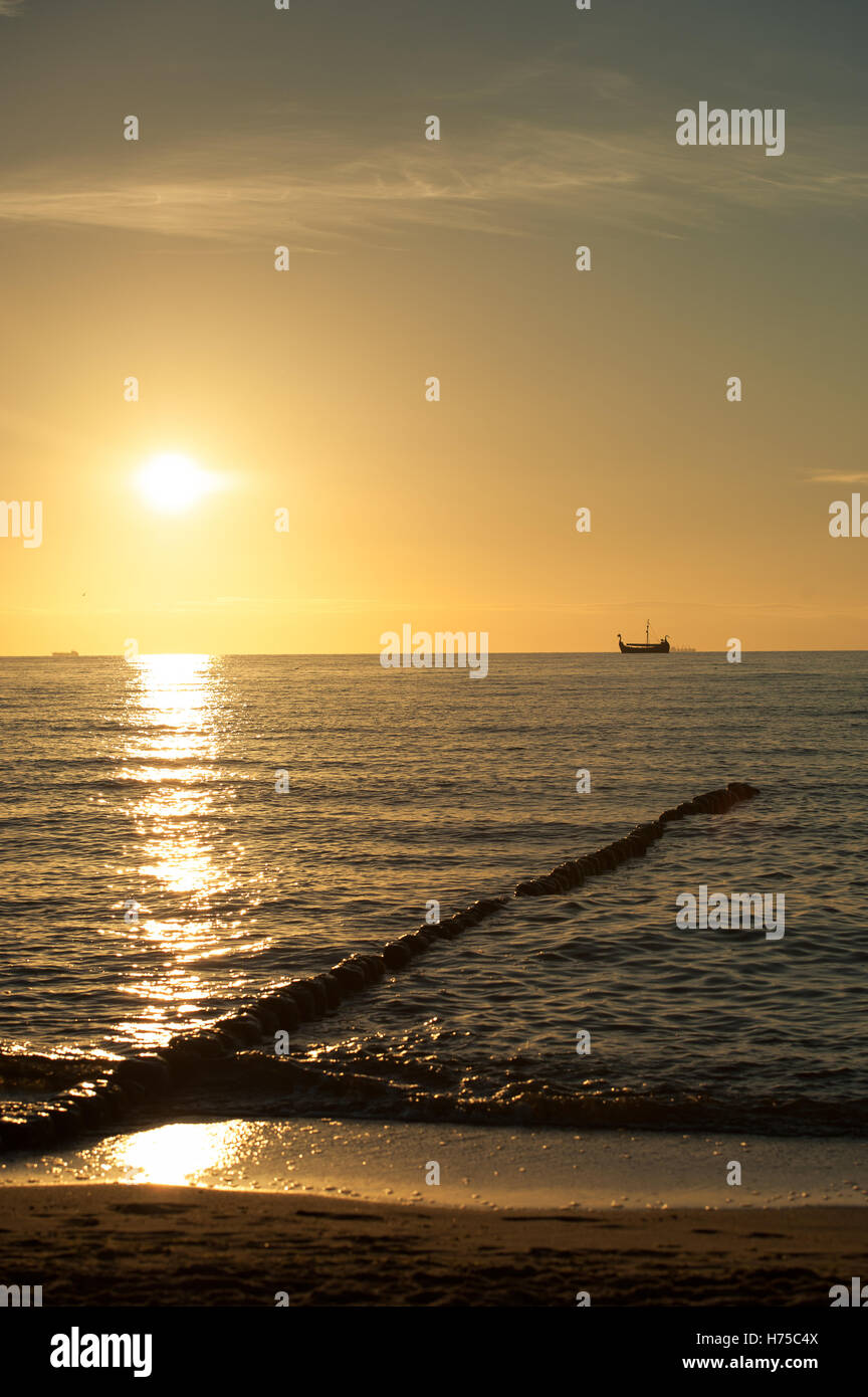 Breakwaters in the Baltic sea over the sunset in summer Stock Photo - Alamy