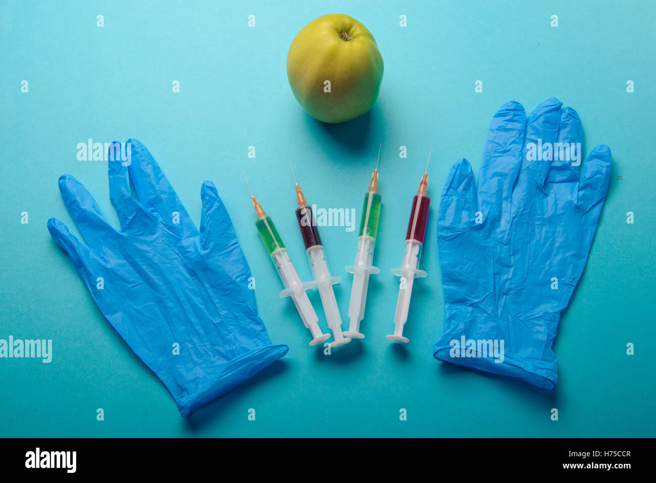 Chemical additives in food or genetically modified fruit concept. Green ...