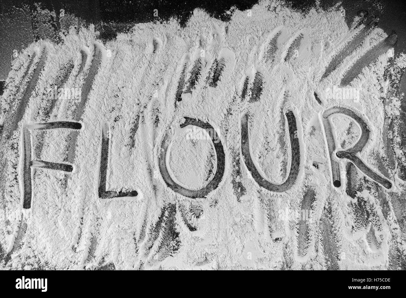 Word flour written in flour on table Stock Photo - Alamy