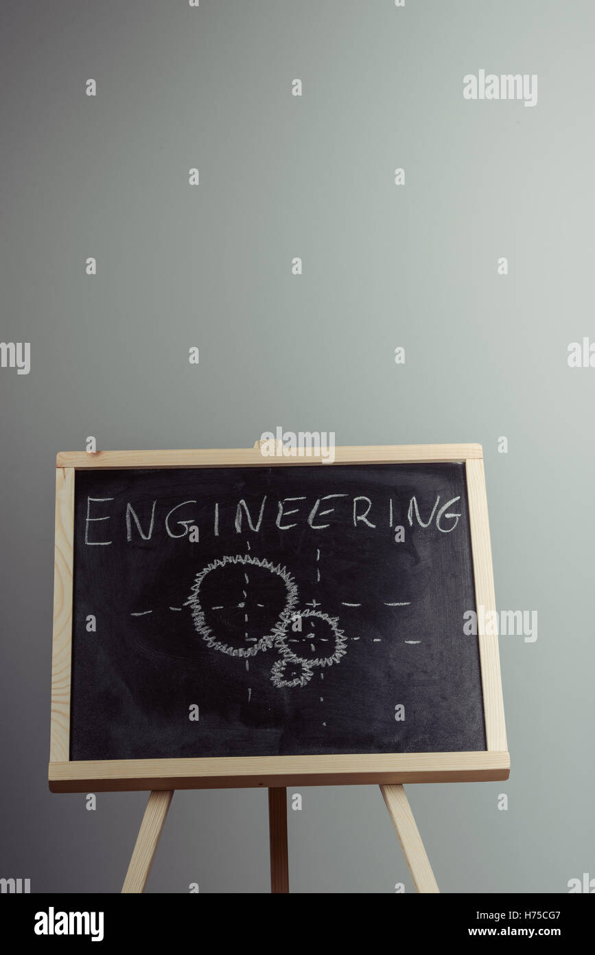 Engineering word handwritten on chalkboard. Gray background Stock Photo ...