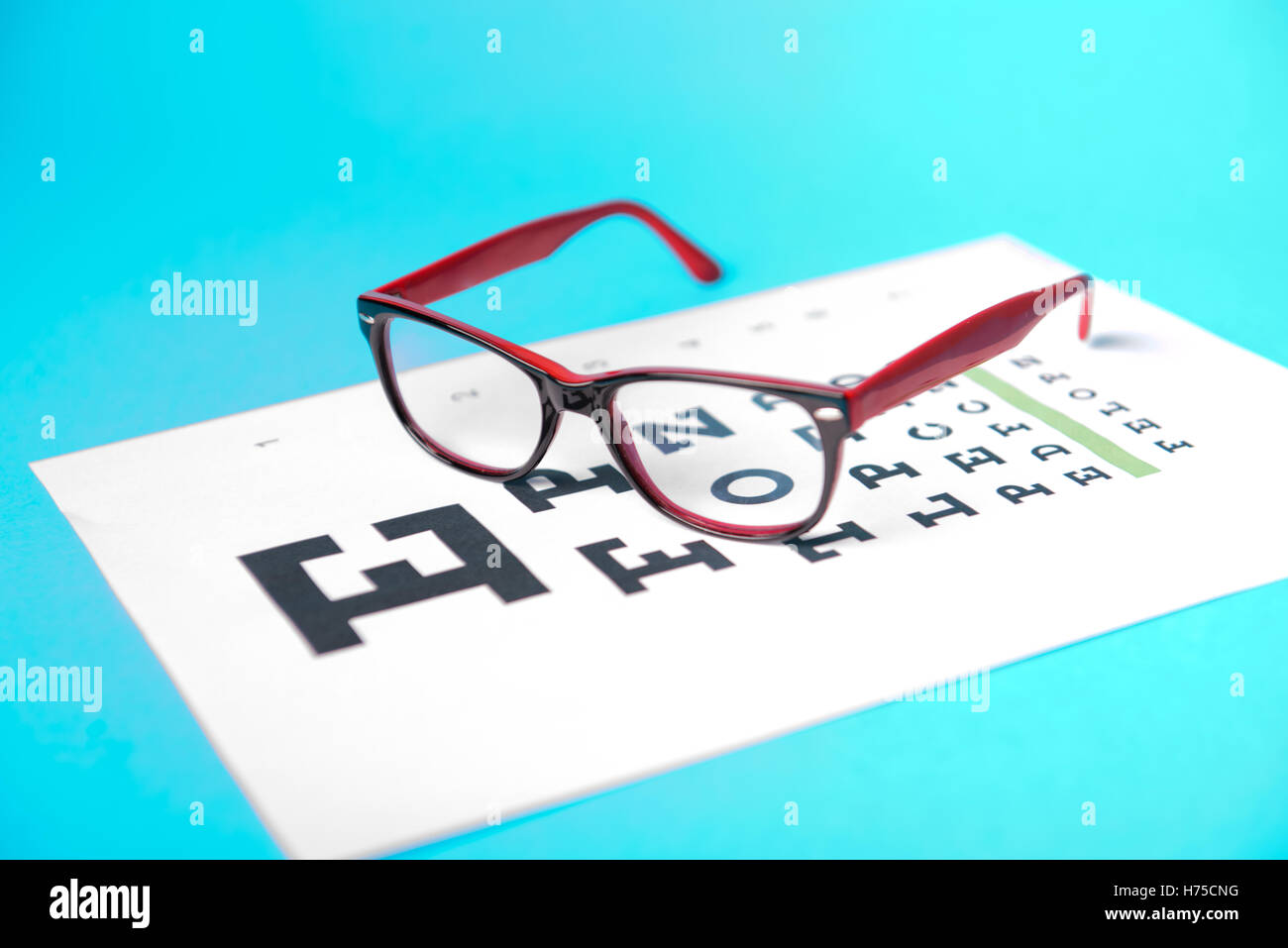 close up view of glasses lying on snellen test chart Stock Photo - Alamy