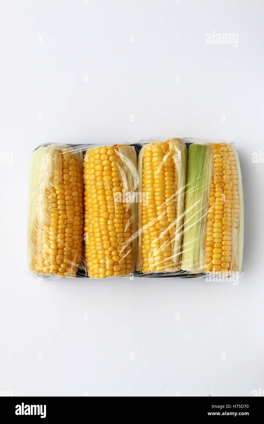 Fresh sweetcorn in a pack isolated against white background Stock Photo ...