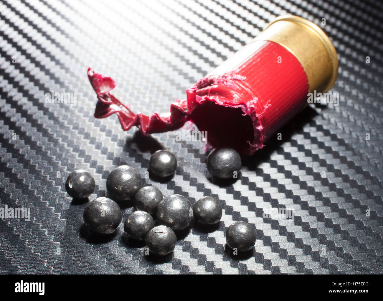 Shotgun ammo with buckshot pellets spilling after opening Stock Photo ...