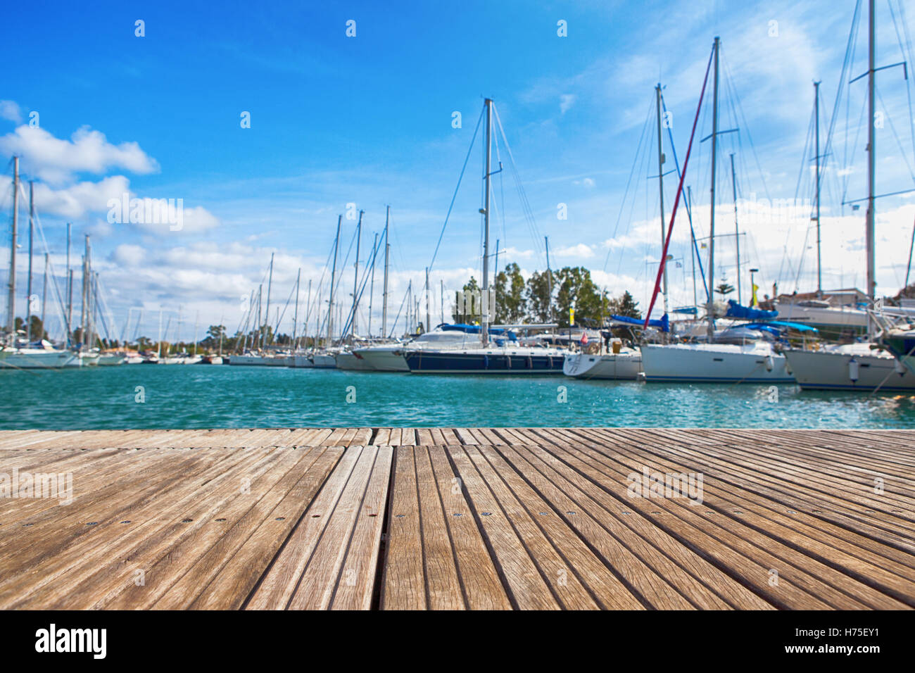 wooden jetty in the background the port yacht Stock Photo - Alamy