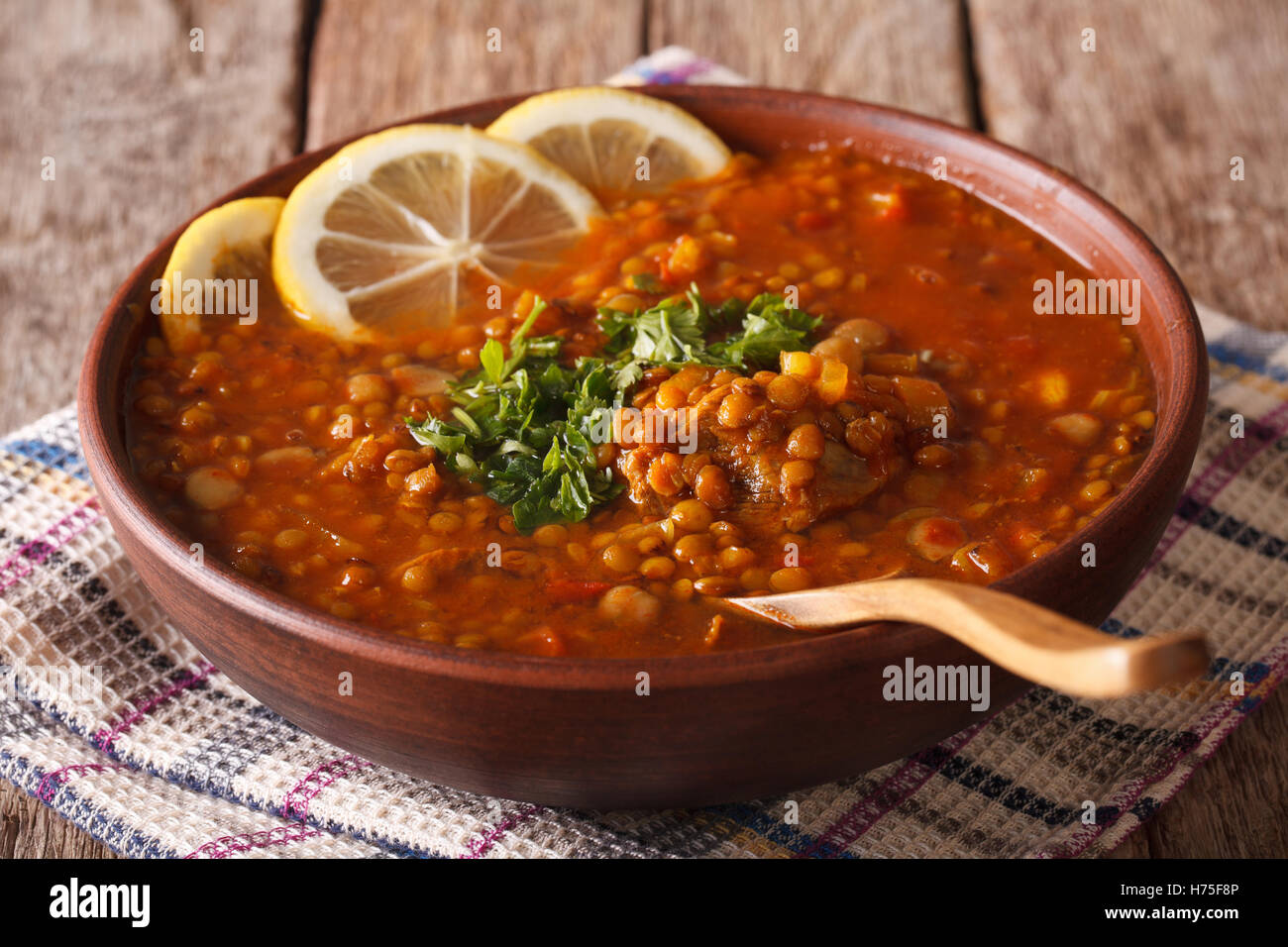 Thick Moroccan Harira soup in a bowl close-up on the table. Horizontal ...