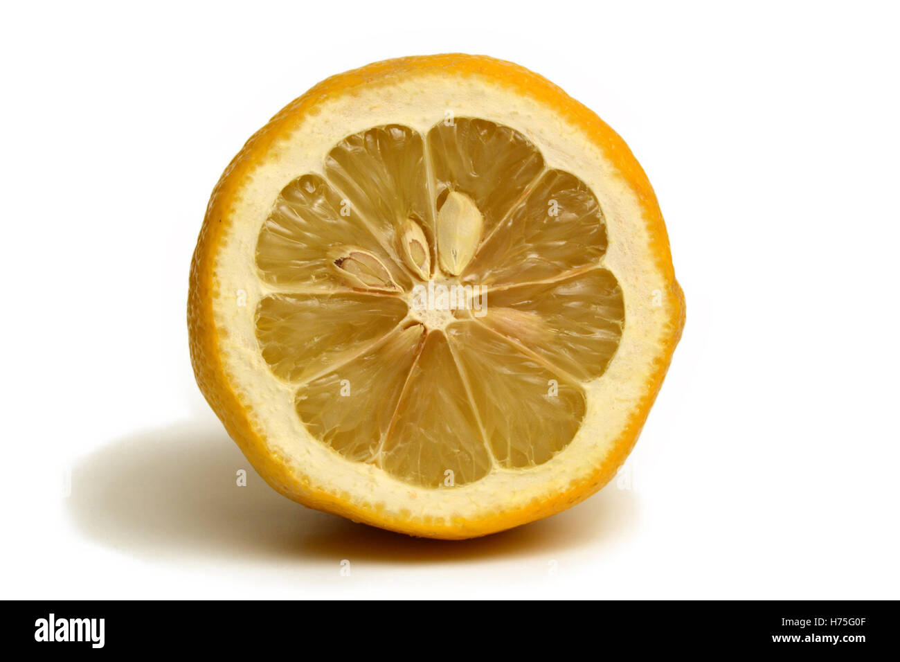 Cut lemon on a white background Stock Photo - Alamy