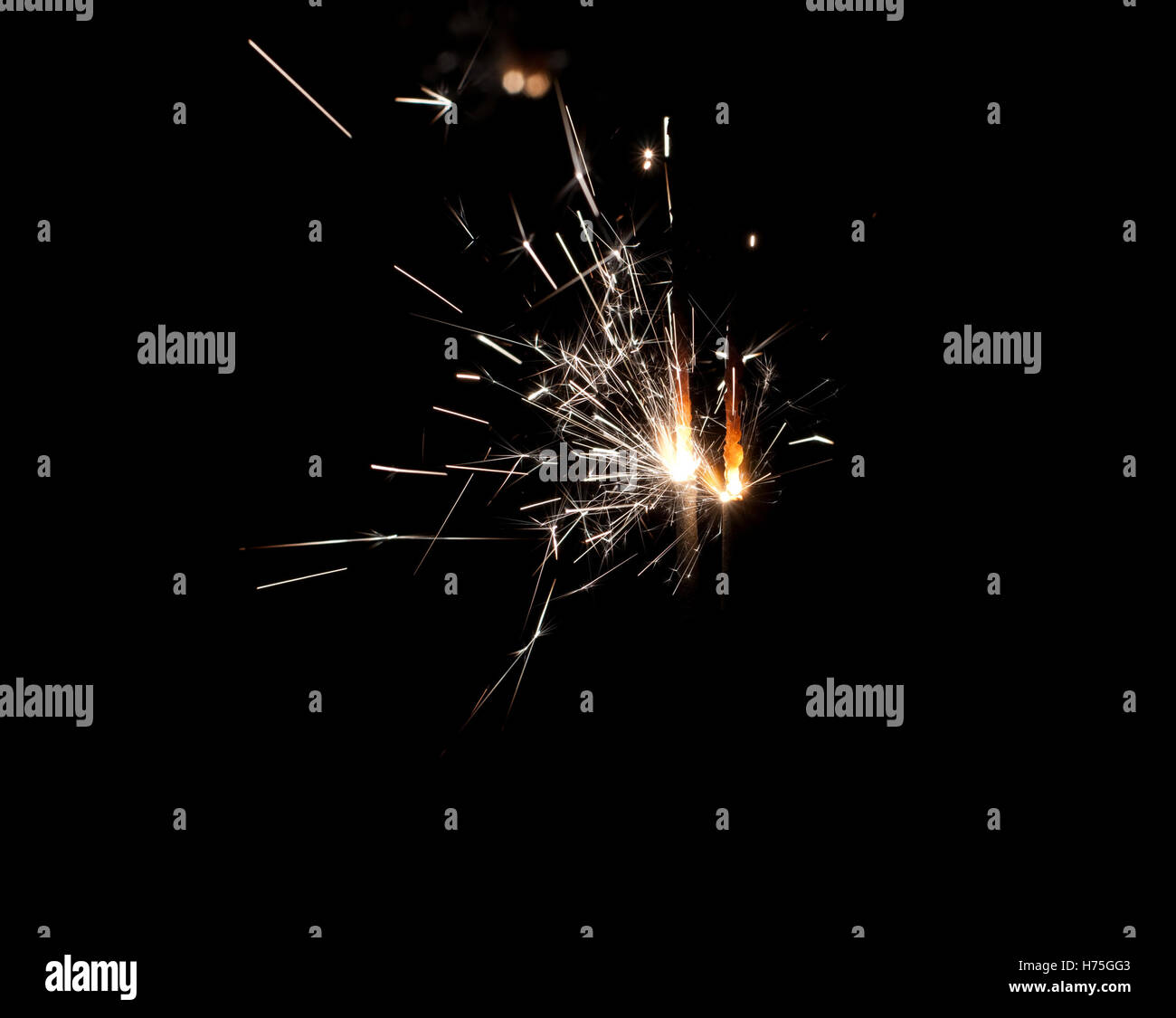 Two sparklers on a black background Stock Photo - Alamy