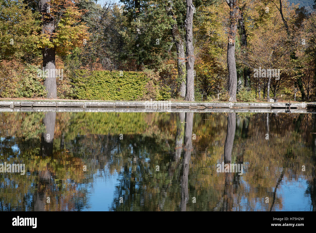 Pond in the Garden of Royal Palace of The Granja. Reflections on water ...