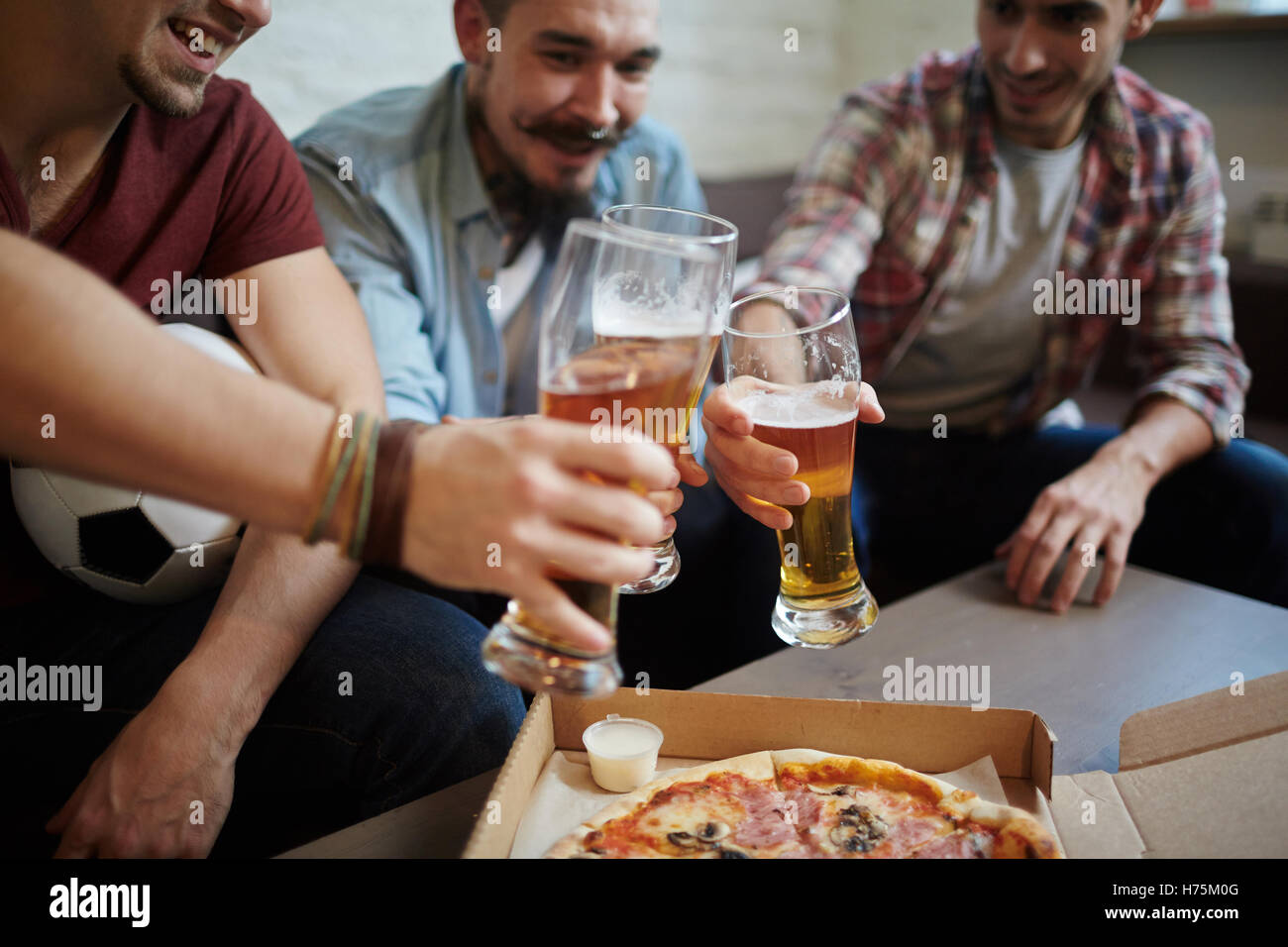 Toasting with beer Stock Photo - Alamy