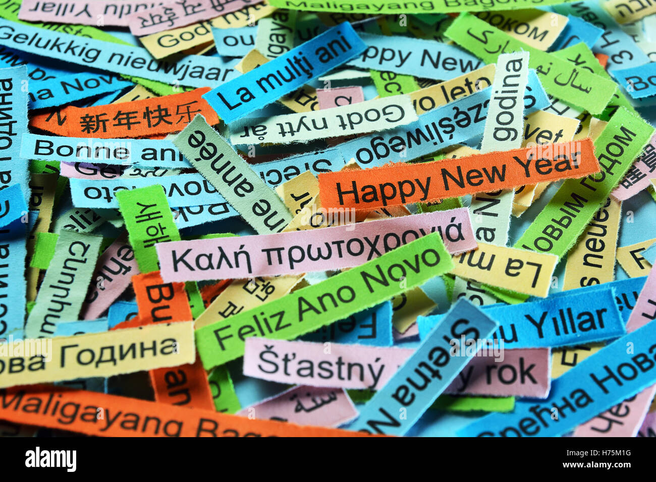 Happy New Year Word Cloud printed on colorful paper different languages ...