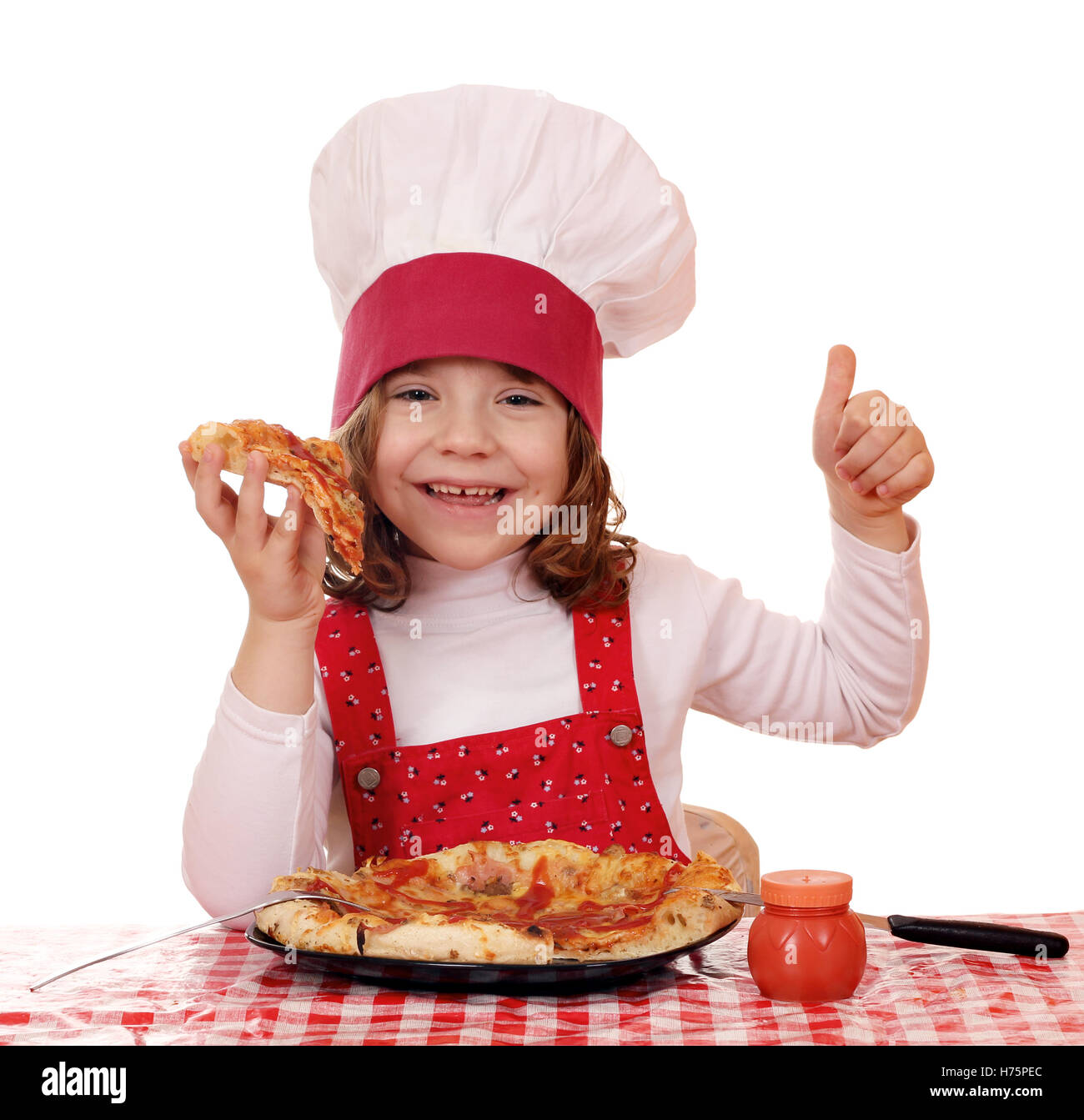 happy little girl cook eat pizza Stock Photo - Alamy