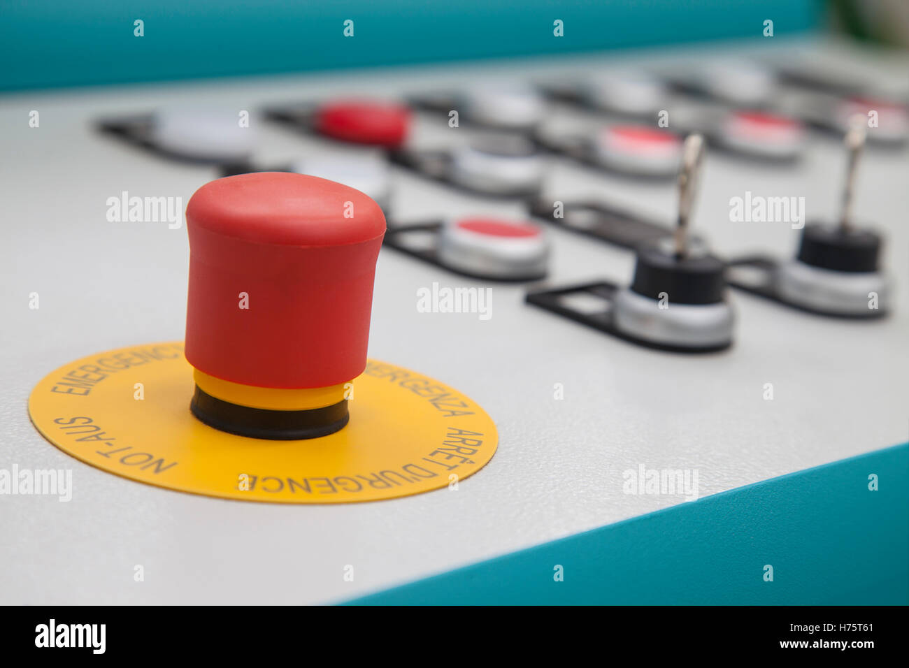 A red emergency panic button with two protection keys next to in the ...