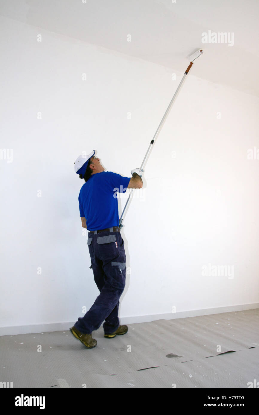 house painter at work in a house Stock Photo - Alamy