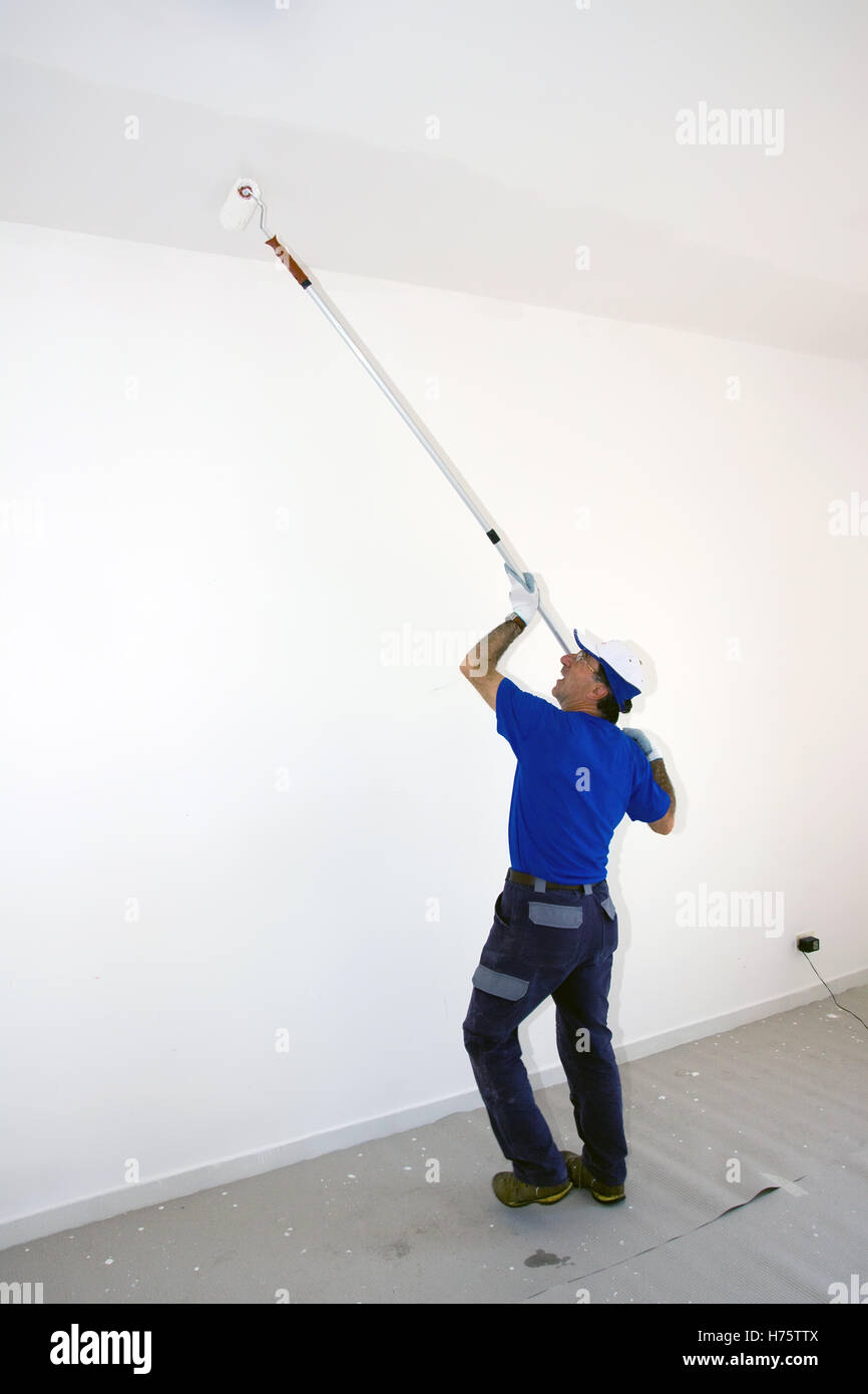 house painter at work in a house Stock Photo - Alamy