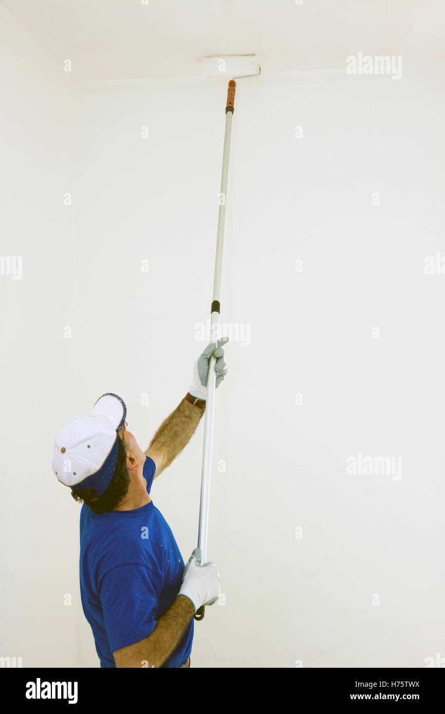 house painter at work in a house Stock Photo - Alamy