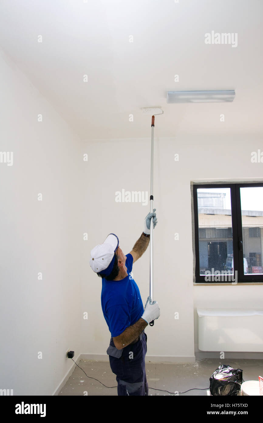 house painter at work in a house Stock Photo - Alamy