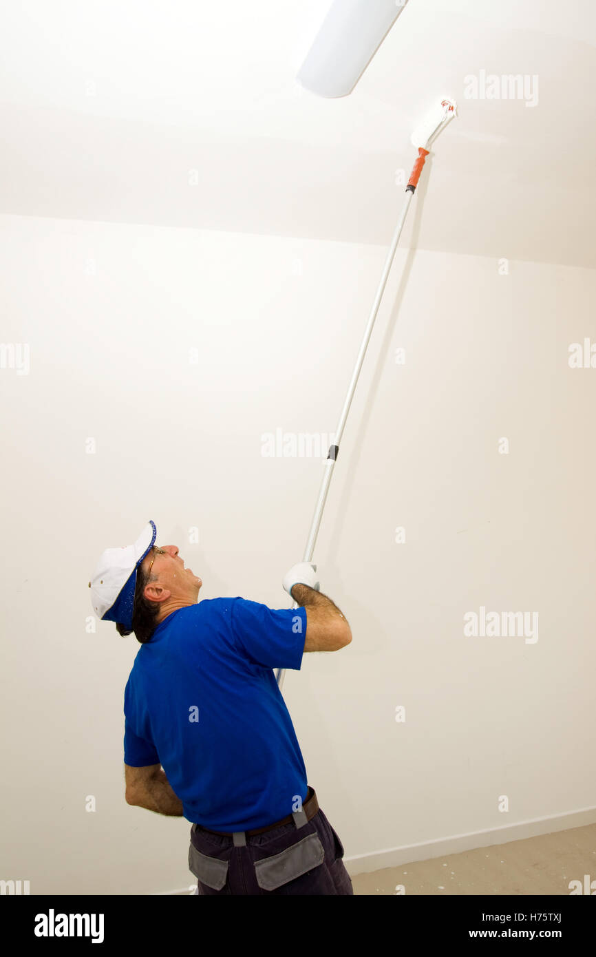house painter at work in a house Stock Photo - Alamy