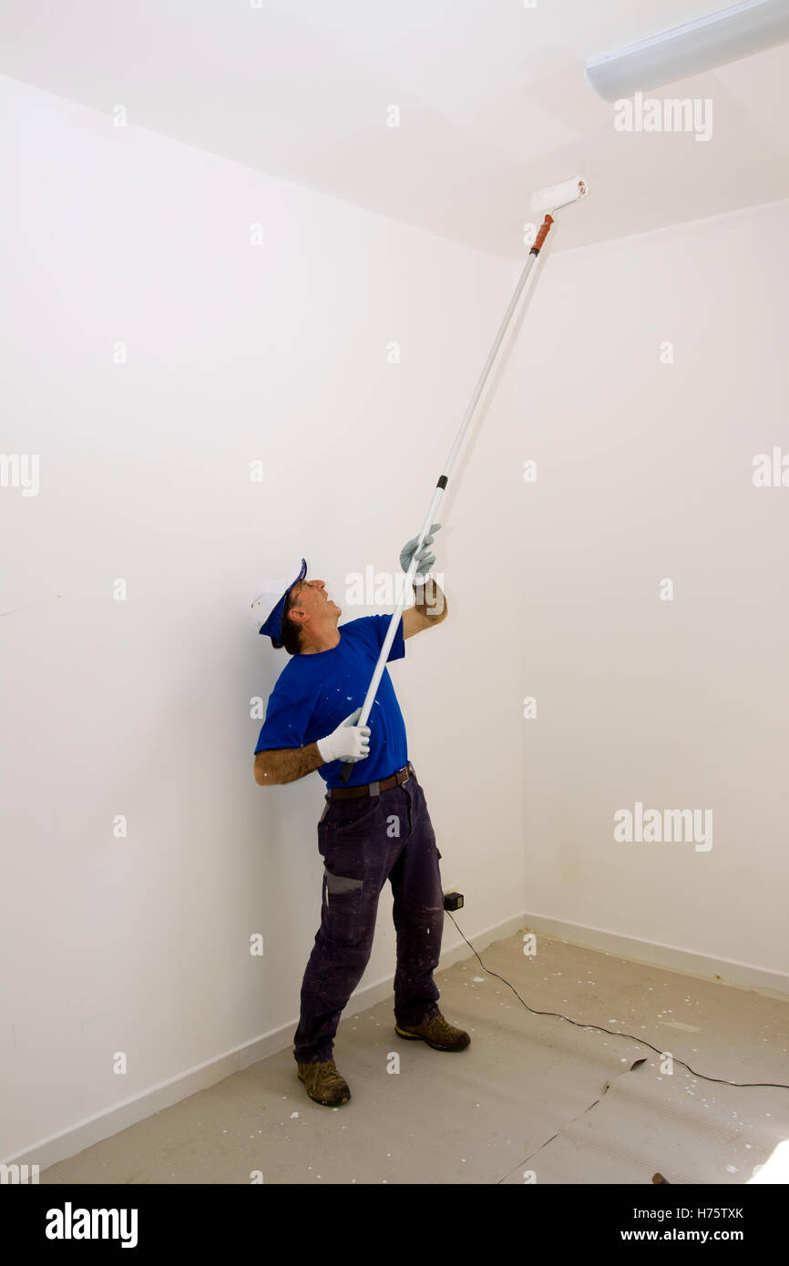 house painter at work in a house Stock Photo - Alamy