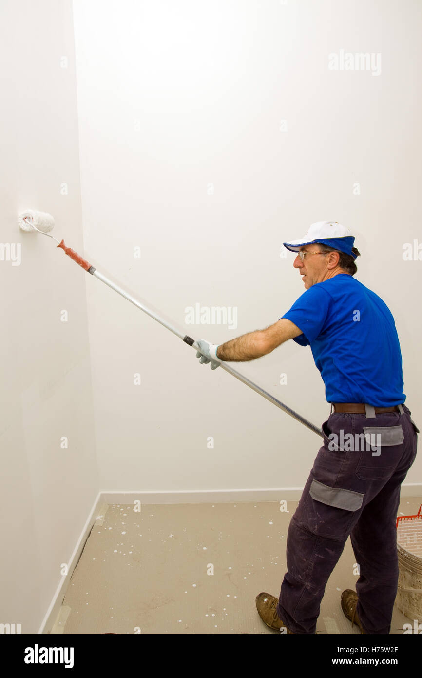 house painter at work in a house Stock Photo - Alamy