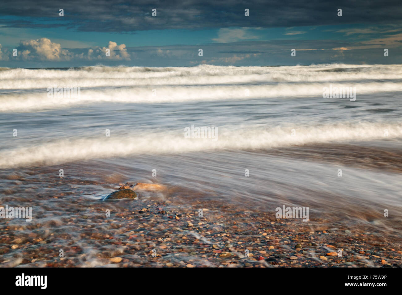 Long exposure capturing wave movement on a beach Stock Photo - Alamy
