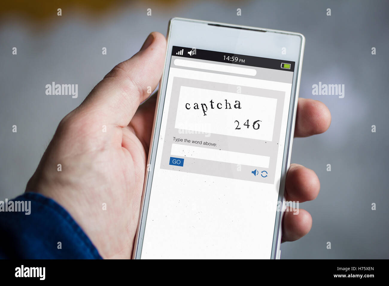 man hand holding captcha smartphone. All screen graphics are made up ...