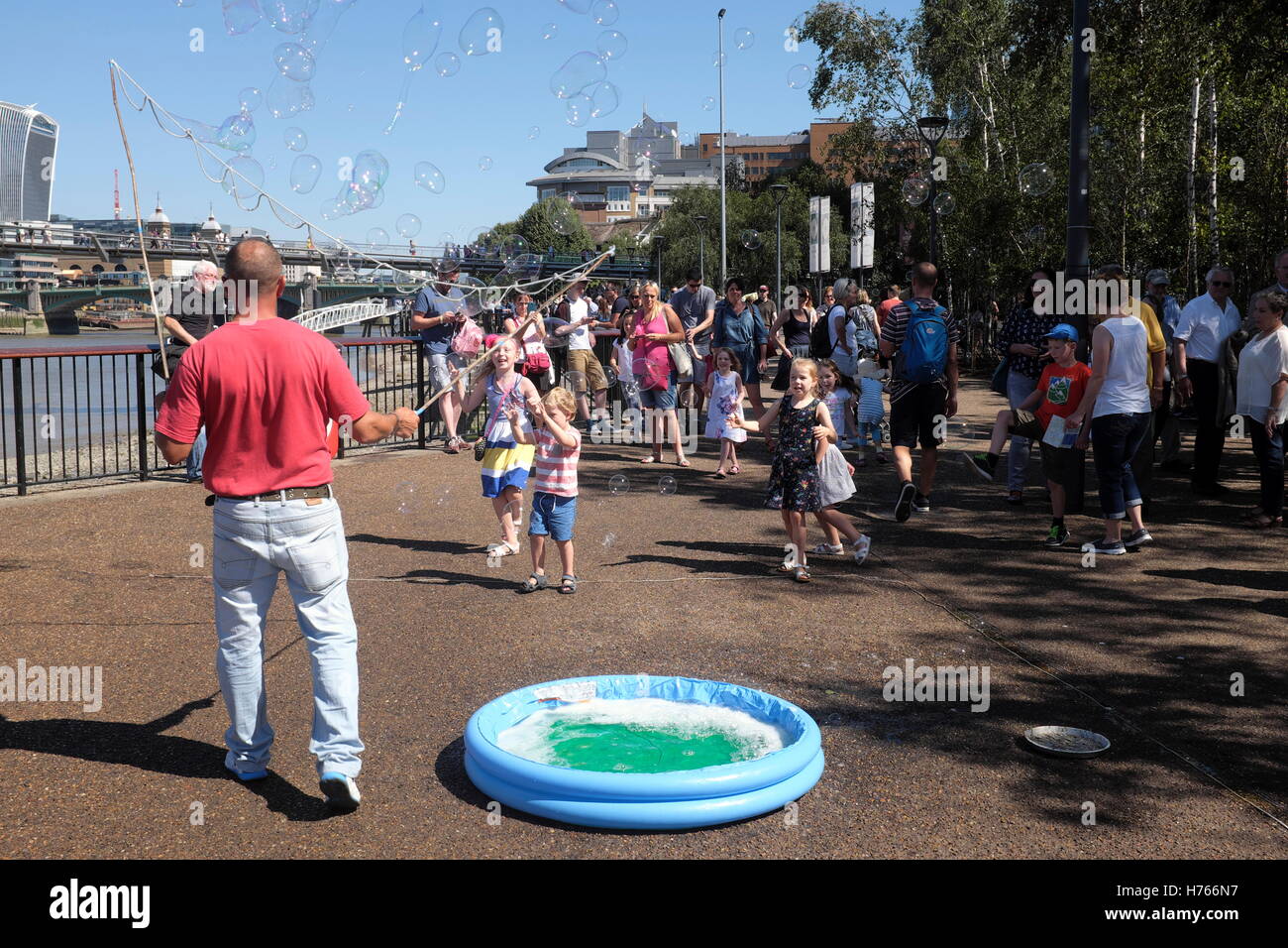 Children chasing bubbles hi-res stock photography and images - Alamy