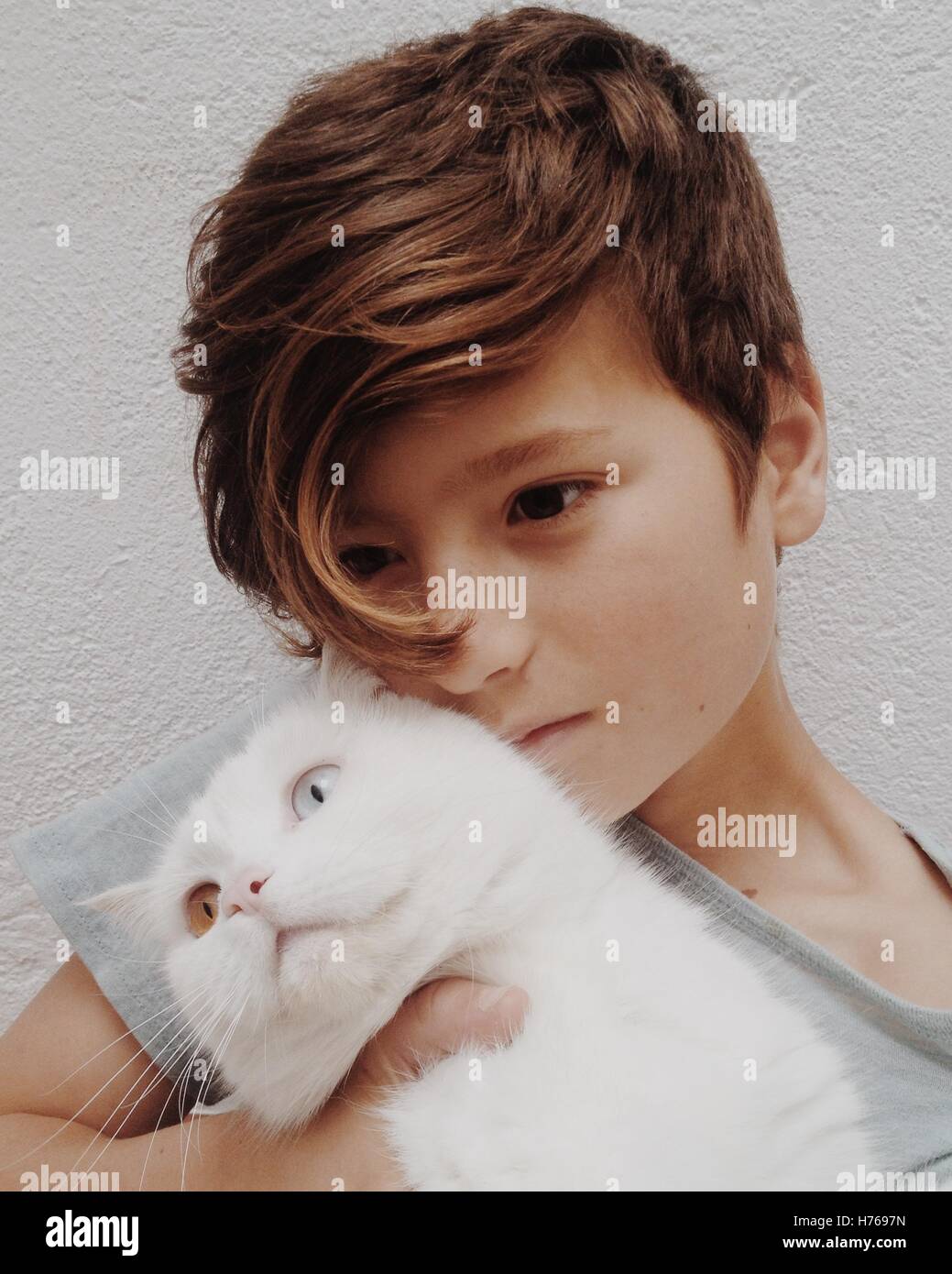 Boy with cat cuddling animals hi-res stock photography and images - Alamy