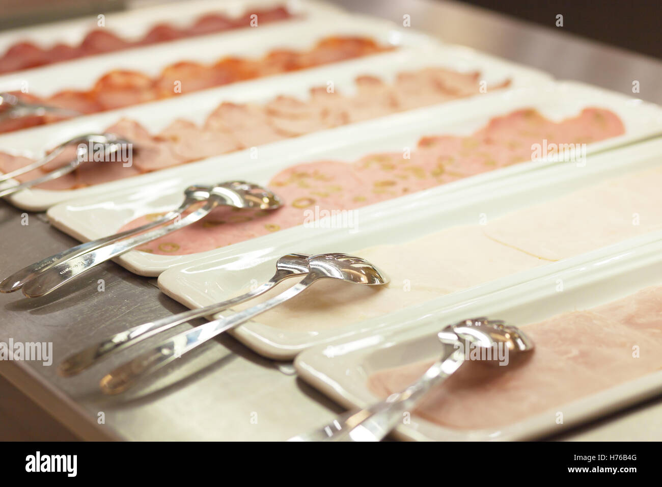 Slices of cured meats at breakfast buffet Stock Photo - Alamy