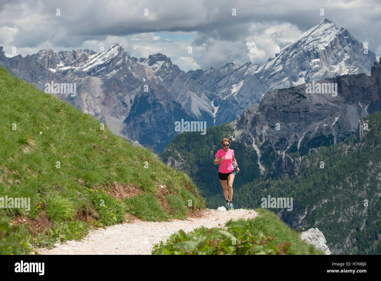 Trail running at the Cinque Torri area in the Dolomites, Italy Stock ...