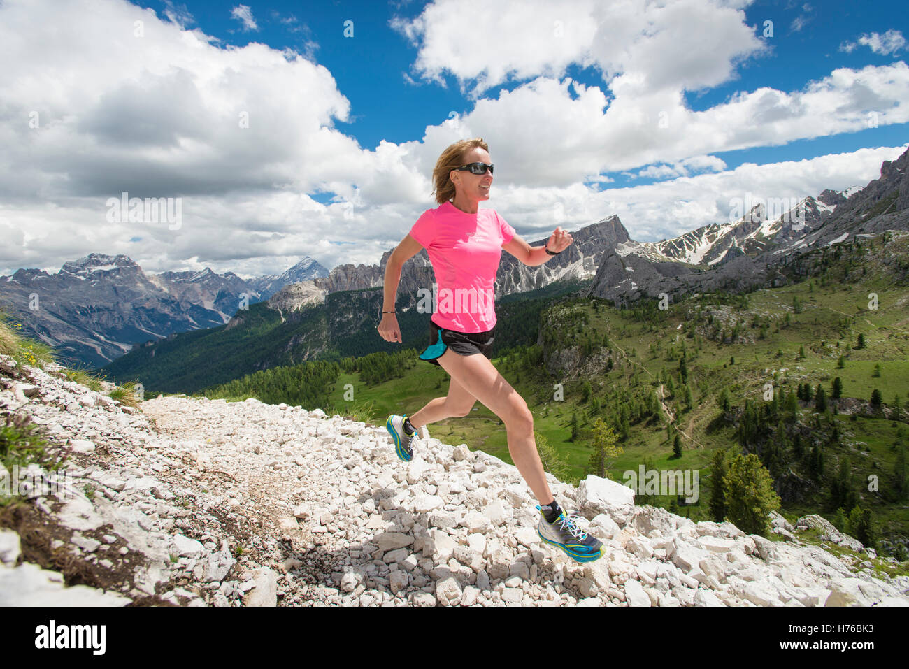 Trail running at the Cinque Torri area in the Dolomites, Italy Stock ...