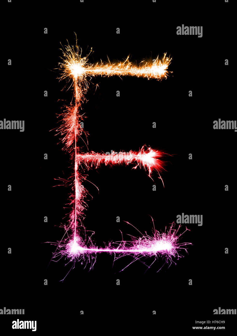 Sparkler firework light alphabet E (Capital Letters) at night ...