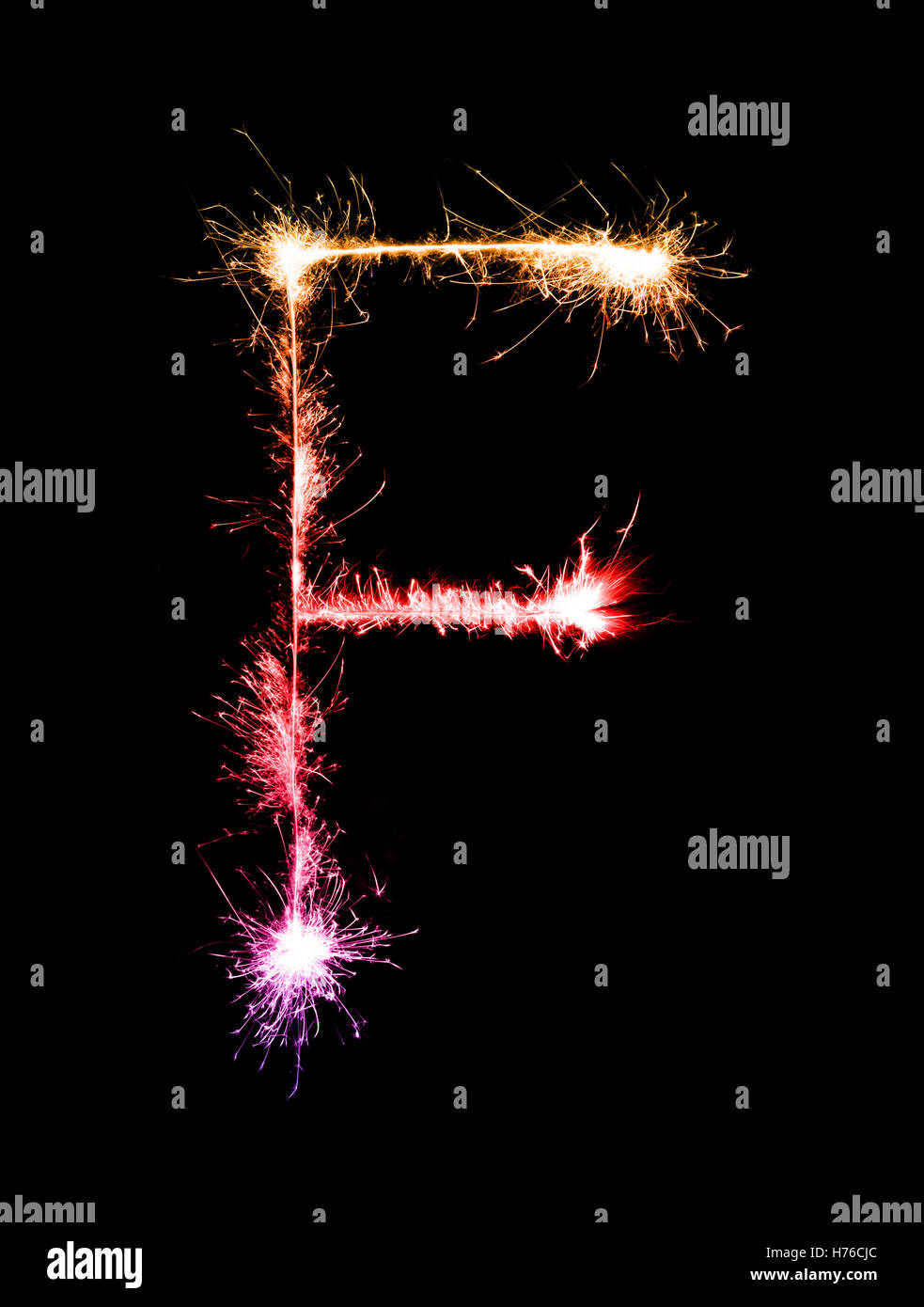 Sparkler firework light alphabet F (Capital Letters) at night ...