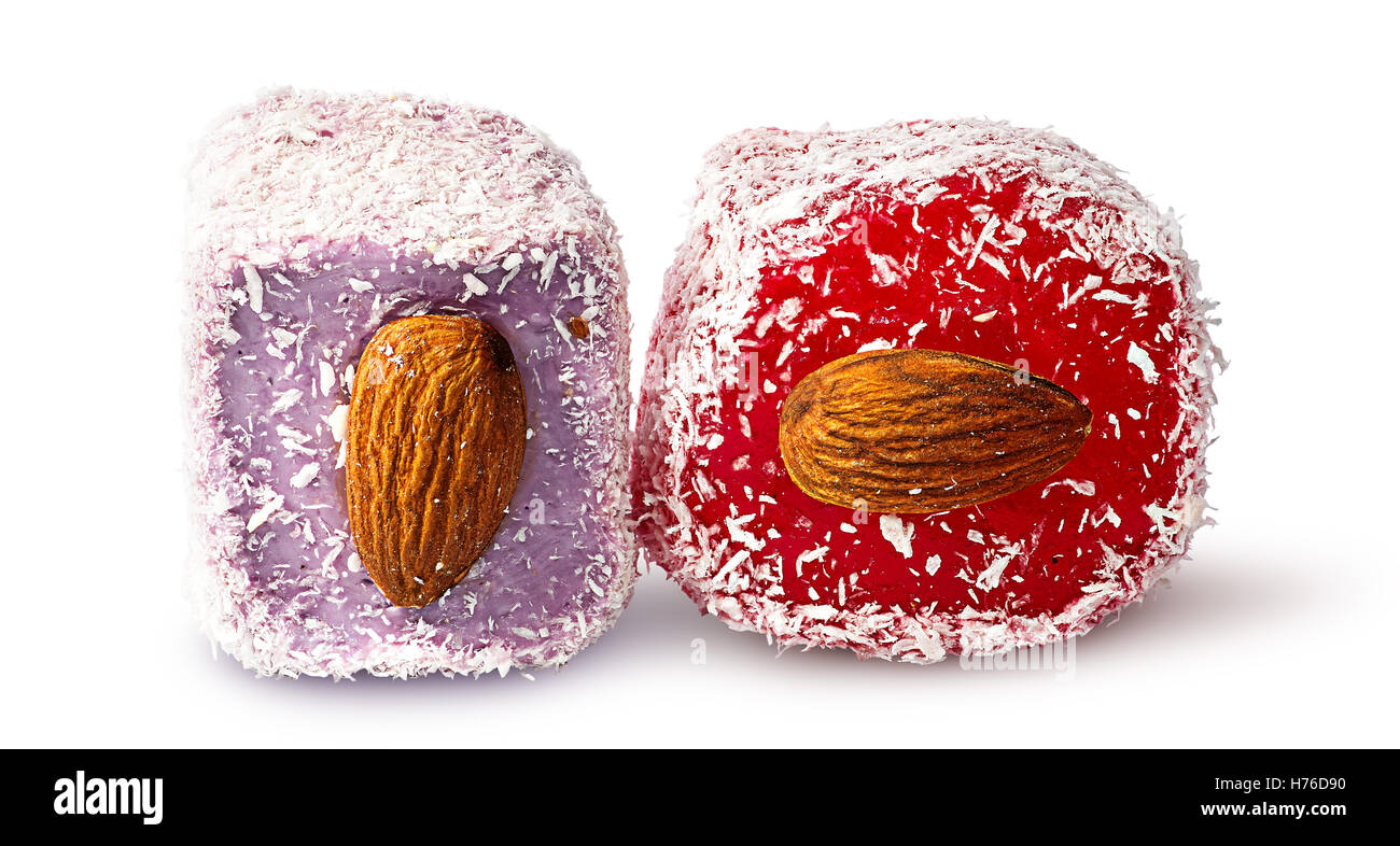 Two pieces of Turkish Delight with almonds beside isolated on white ...