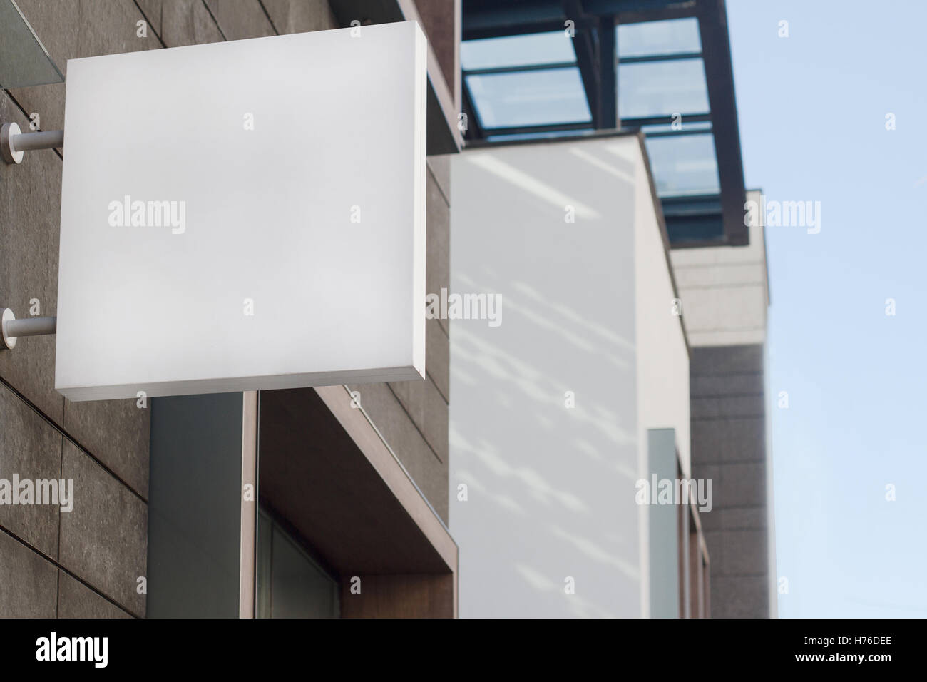 Horizontal front view of empty square signage on a building with modern ...