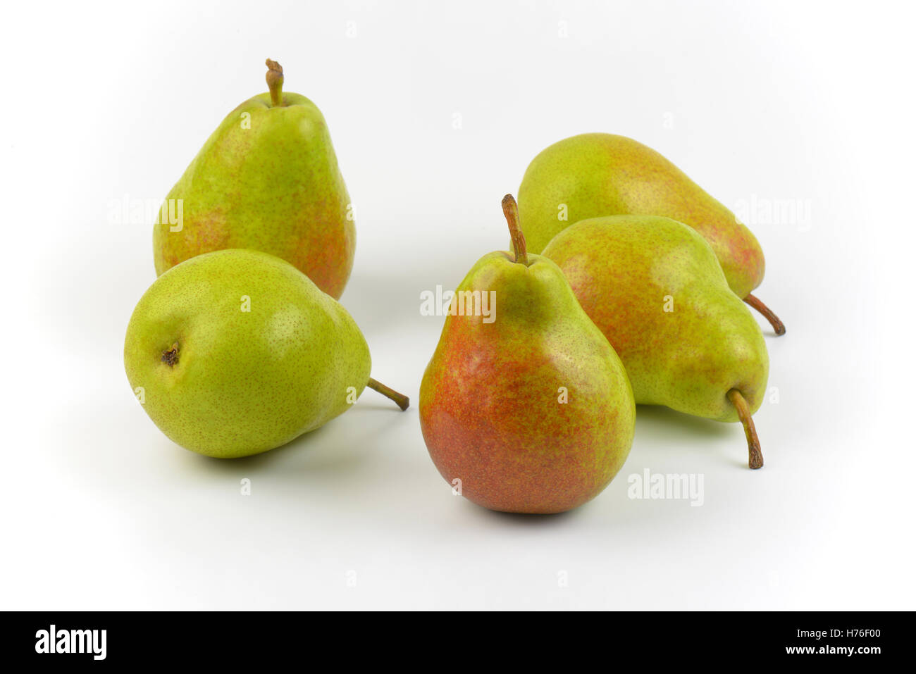 group of ripe pears on white background Stock Photo - Alamy