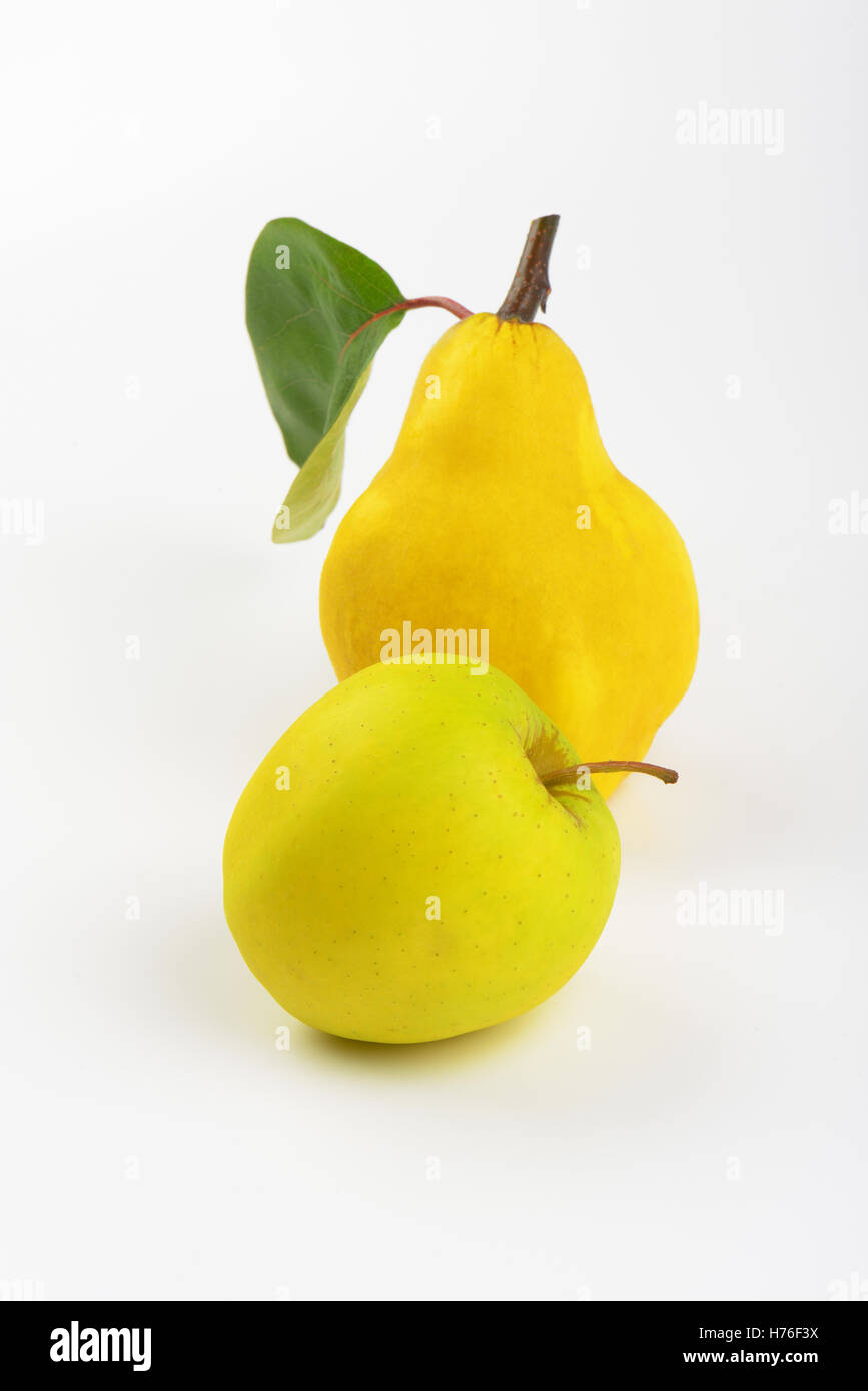 yellow pear and yellow apple on white background Stock Photo - Alamy