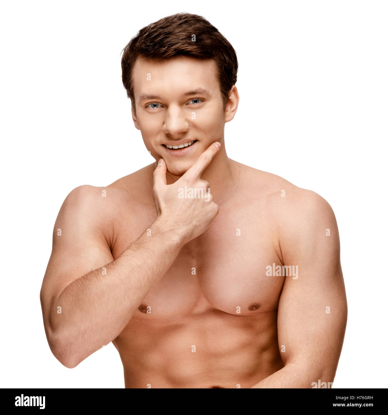 Handsome young man sniffing his armpit Stock Photo - Alamy