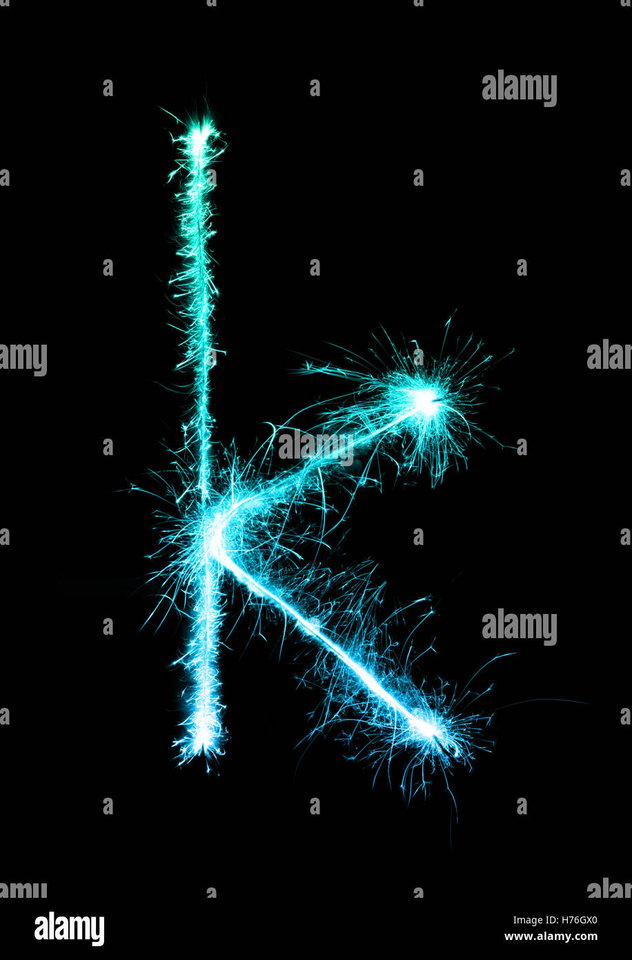 Sparkler firework light alphabet k (Small Letters) at night background ...