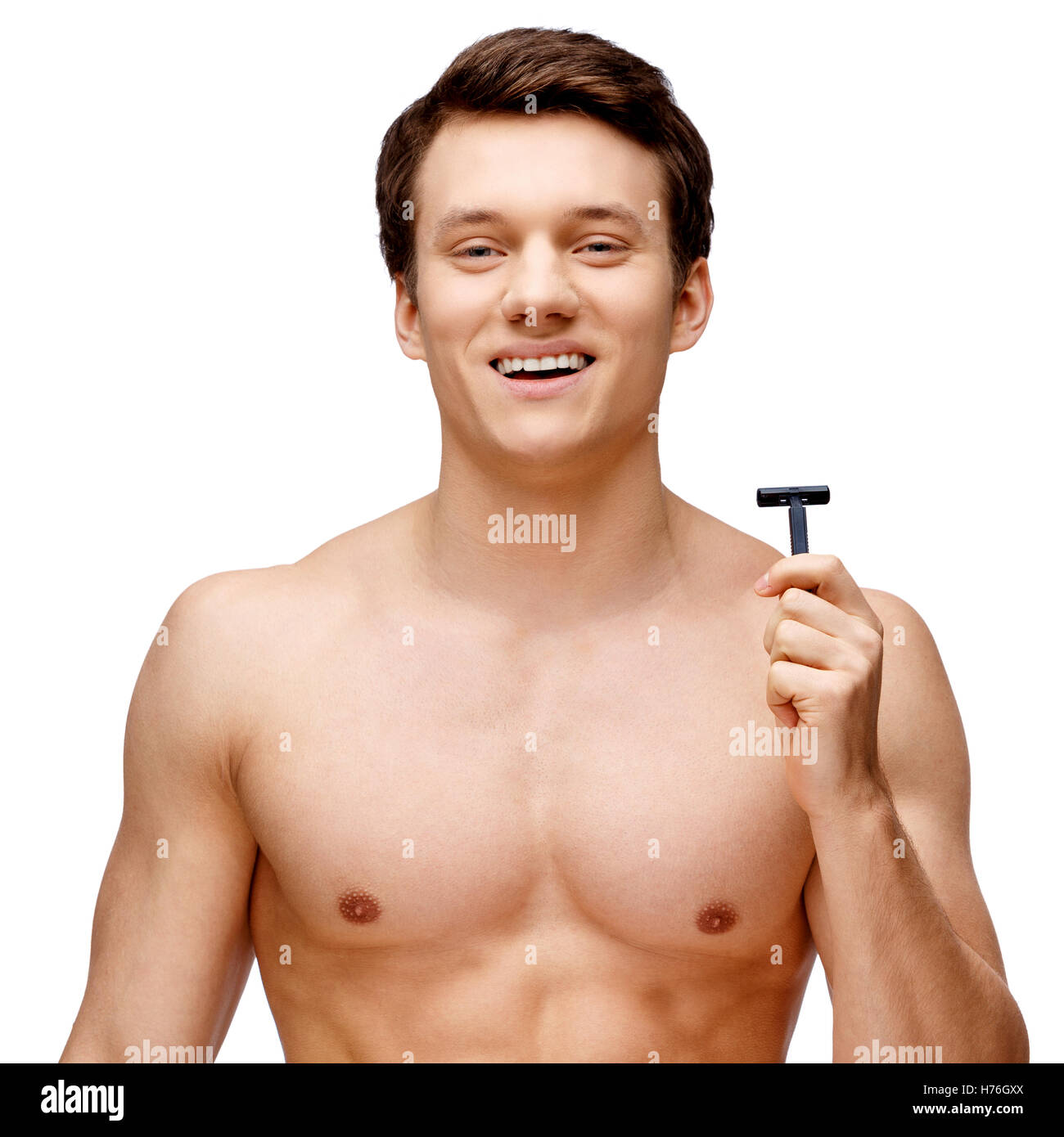 Handsome young man sniffing his armpit Stock Photo - Alamy
